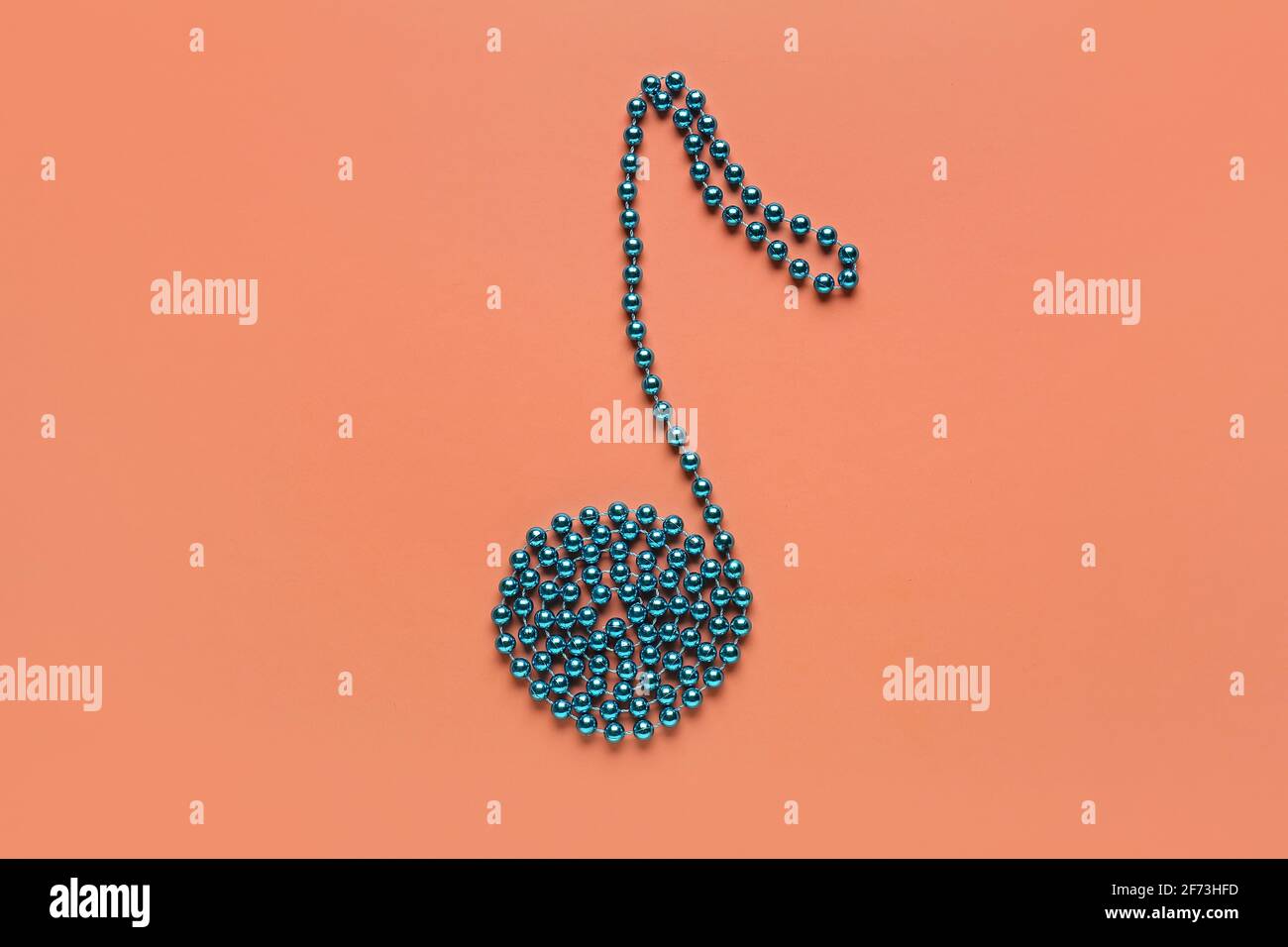 Music note made of beads on color background Stock Photo - Alamy