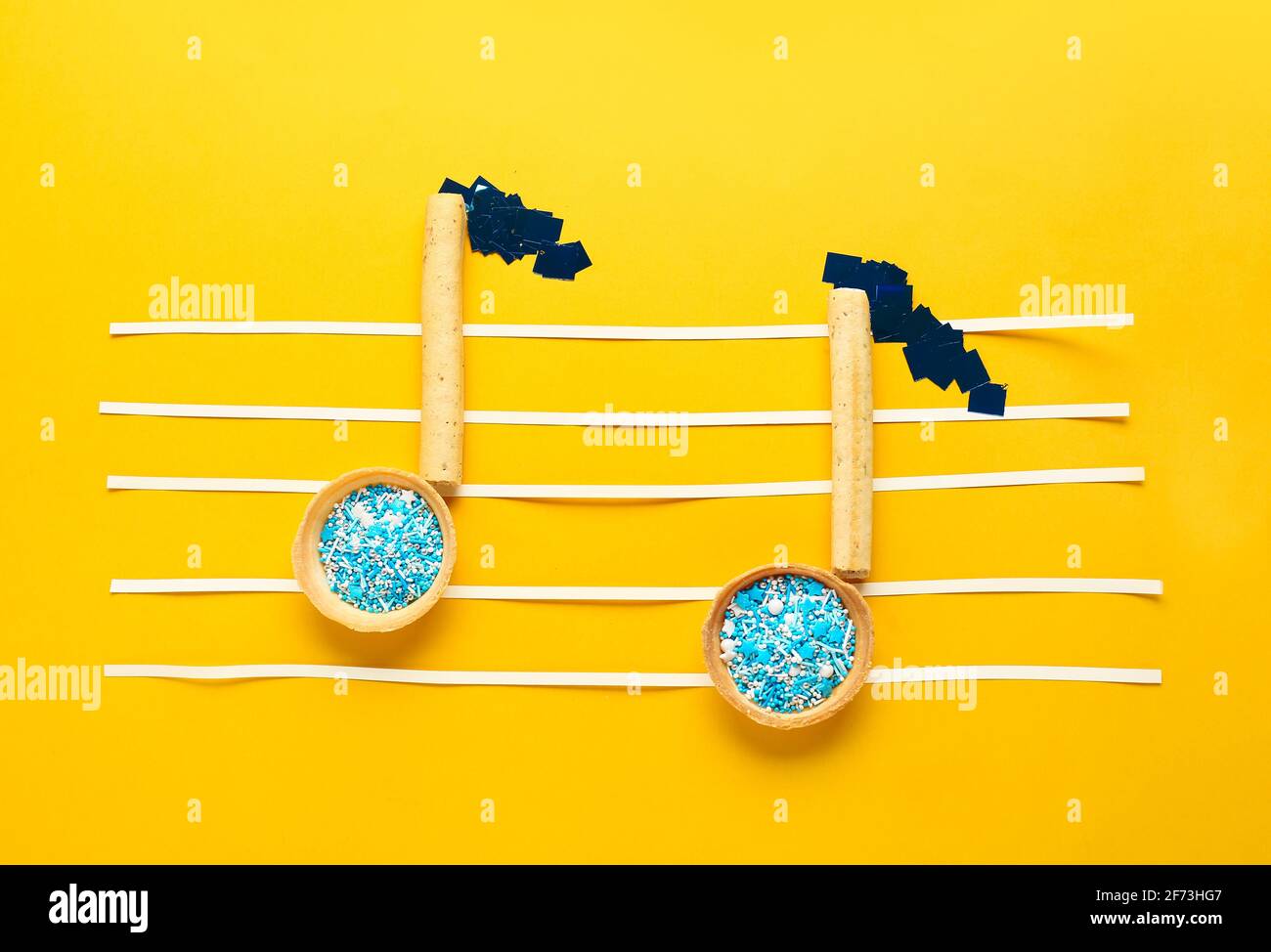 Music notes made of food on color background Stock Photo - Alamy