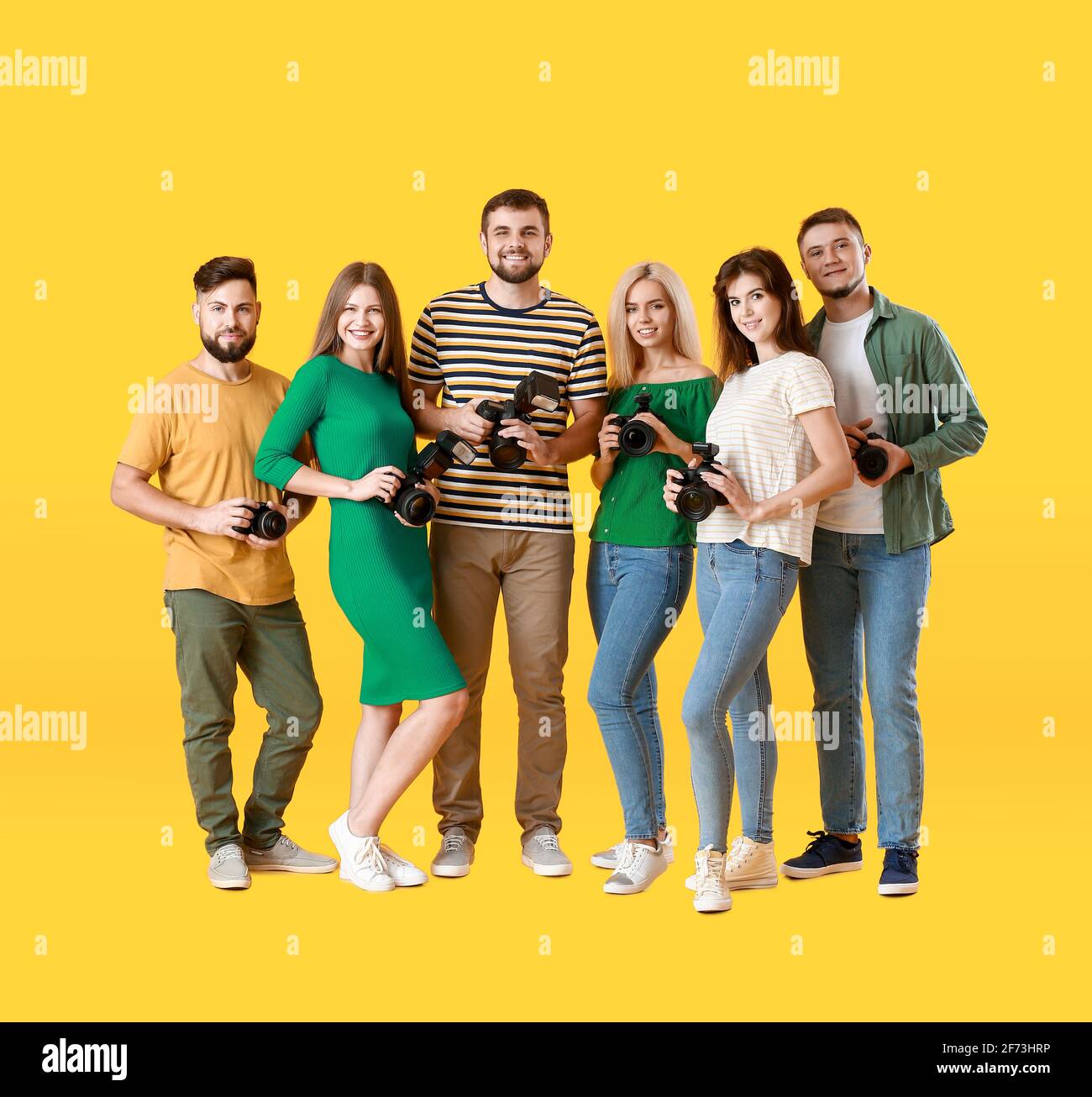 Group of young photographers on color background Stock Photo - Alamy