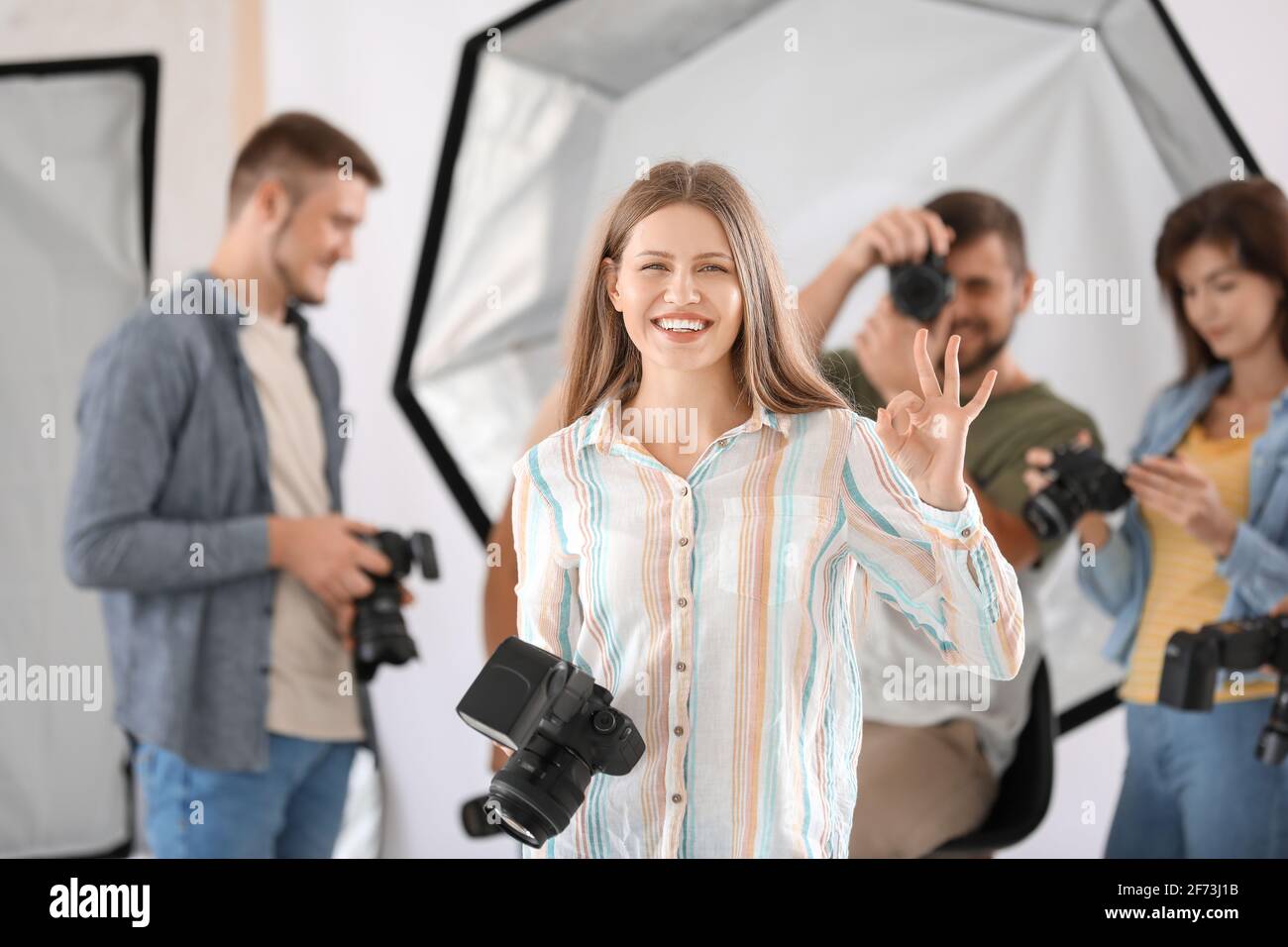 Portrait of female photographer in studio Stock Photo - Alamy