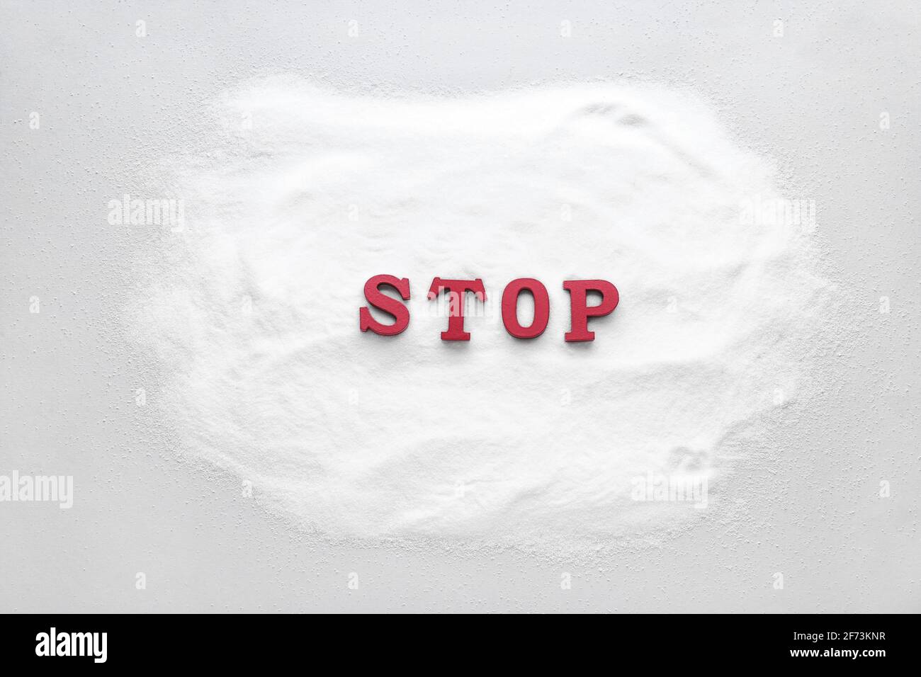 Salt and word STOP on light background Stock Photo - Alamy