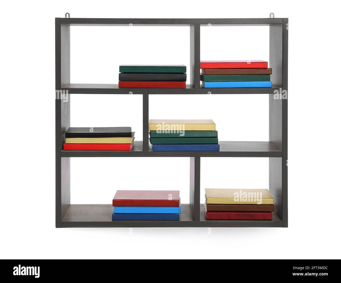 Modern shelf unit with books on white background Stock Photo - Alamy