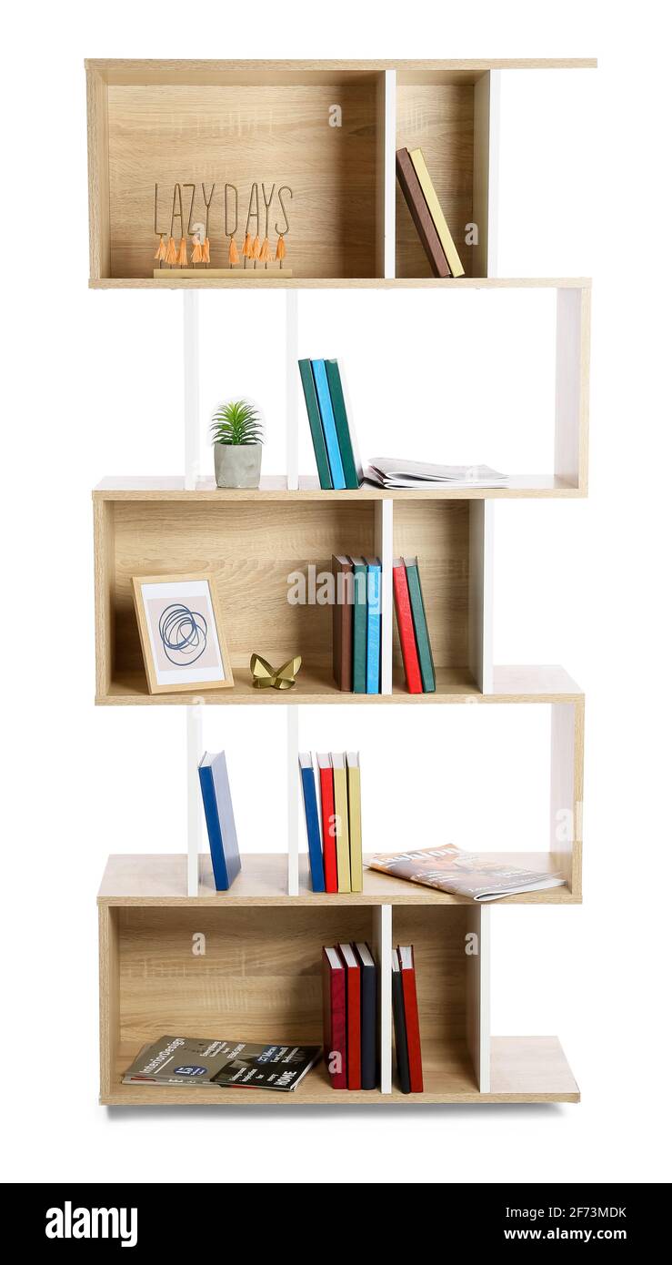 Modern shelf unit with books and decor on white background Stock Photo ...