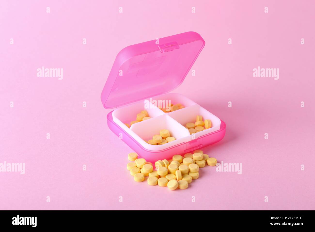 Container with folic acid pills on color background Stock Photo - Alamy