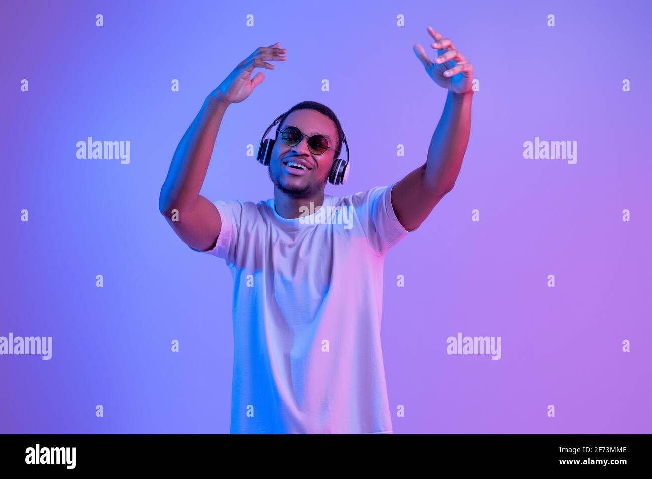 Dancing man neon party night hi-res stock photography and images - Alamy