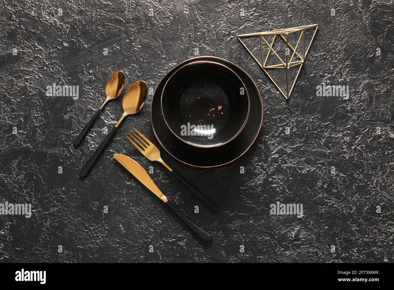 Stylish table setting on dark background Stock Photo - Alamy