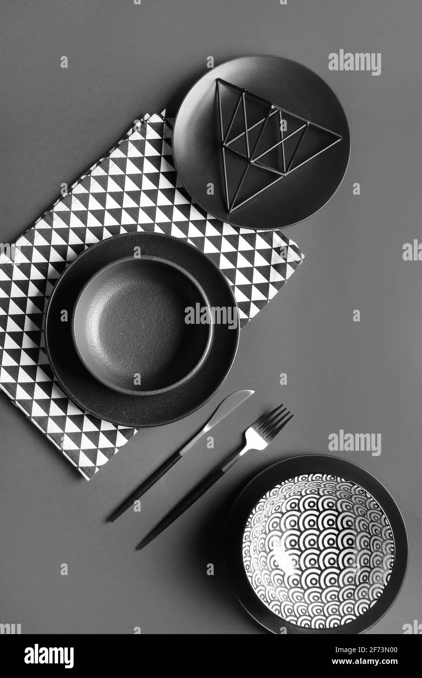 Stylish table setting on dark background Stock Photo - Alamy
