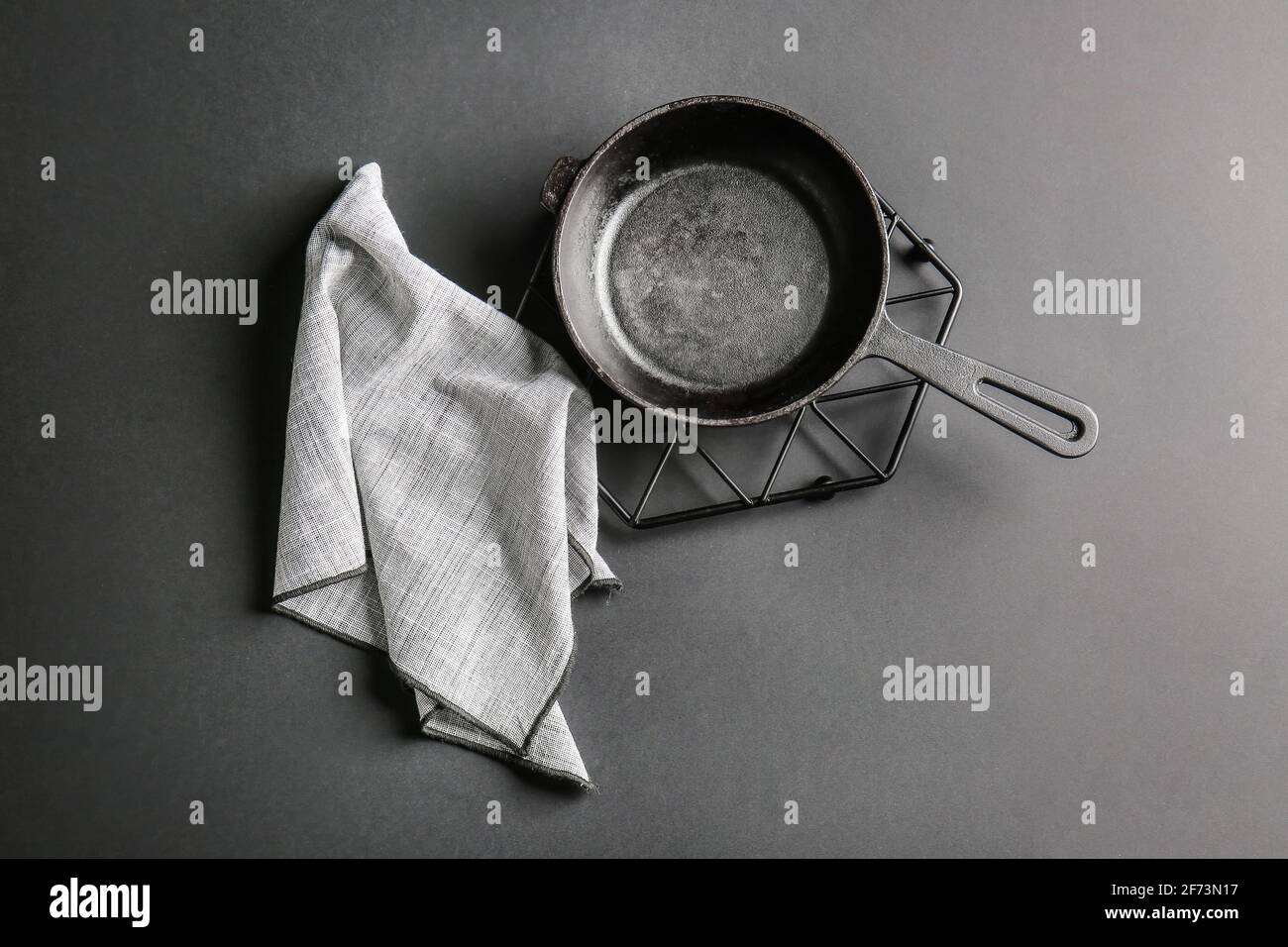 Frying pan on dark background Stock Photo - Alamy