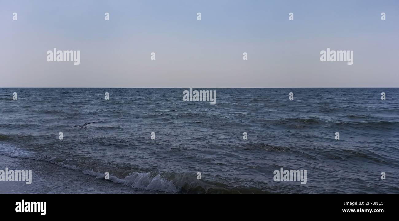 landscape: sea with small waves and distant horizon Stock Photo - Alamy