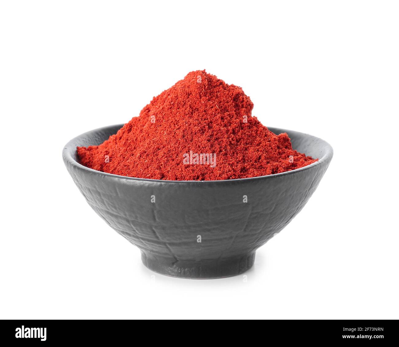 Bowl with red chili powder on white background Stock Photo - Alamy
