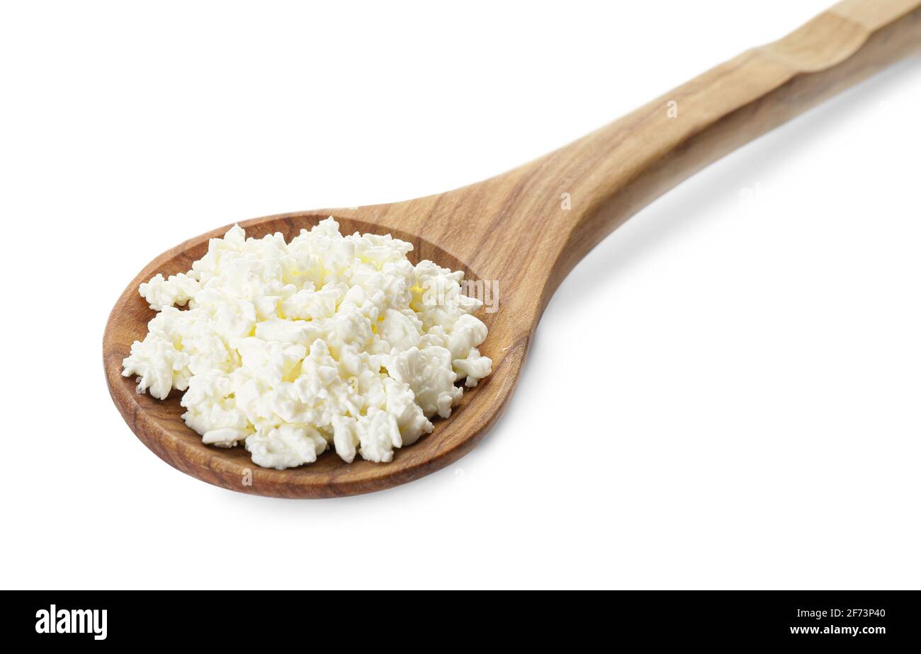 Spoon with cottage cheese on white background Stock Photo - Alamy