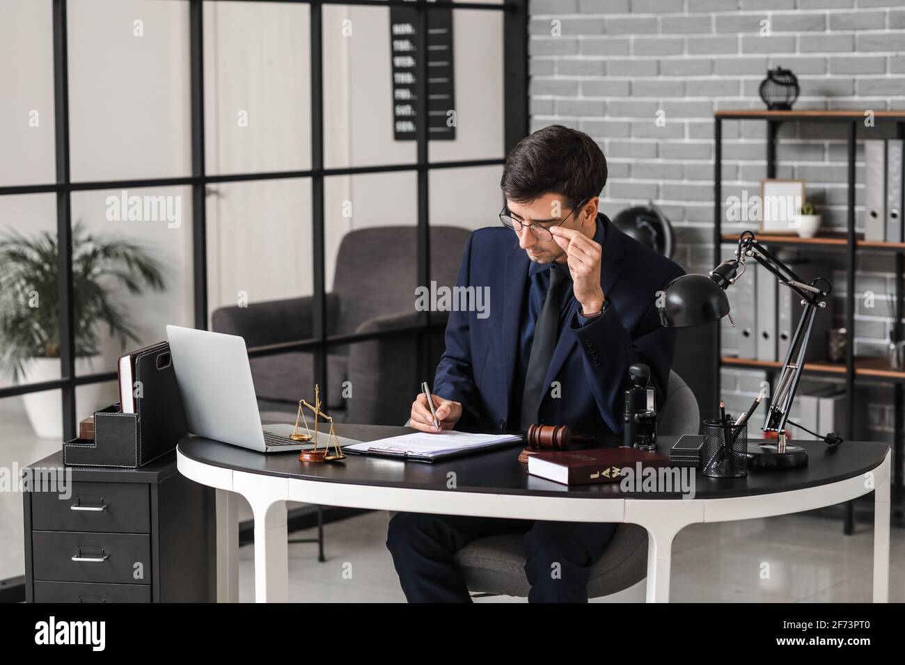 Male judge working in office Stock Photo - Alamy