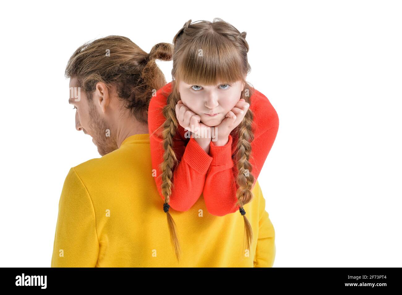 Portrait of father and his displeased daughter on white background ...