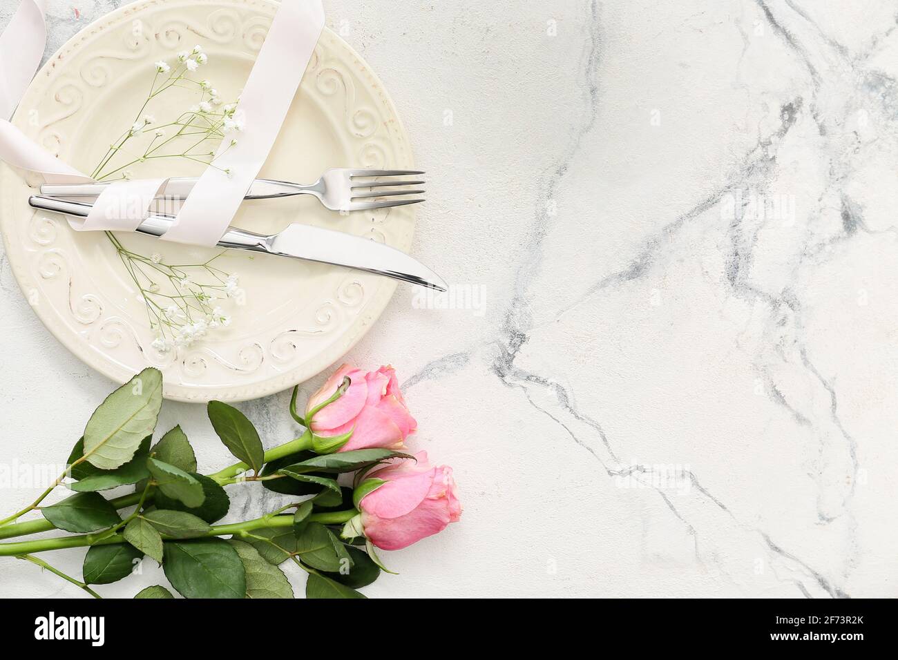 Beautiful table setting on white background Stock Photo - Alamy