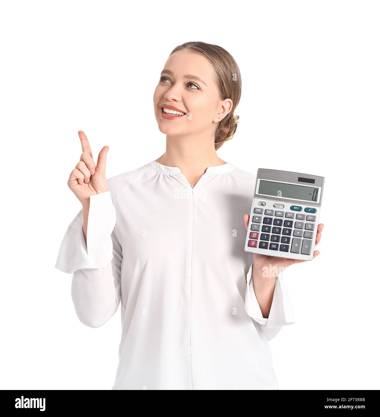 Young woman with calculator showing something on white background Stock ...