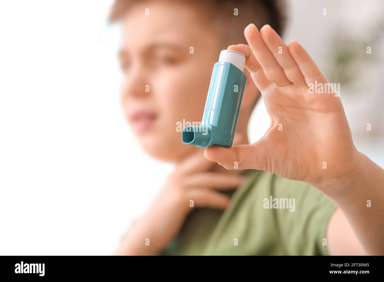 Little boy with inhaler at home, closeup Stock Photo - Alamy