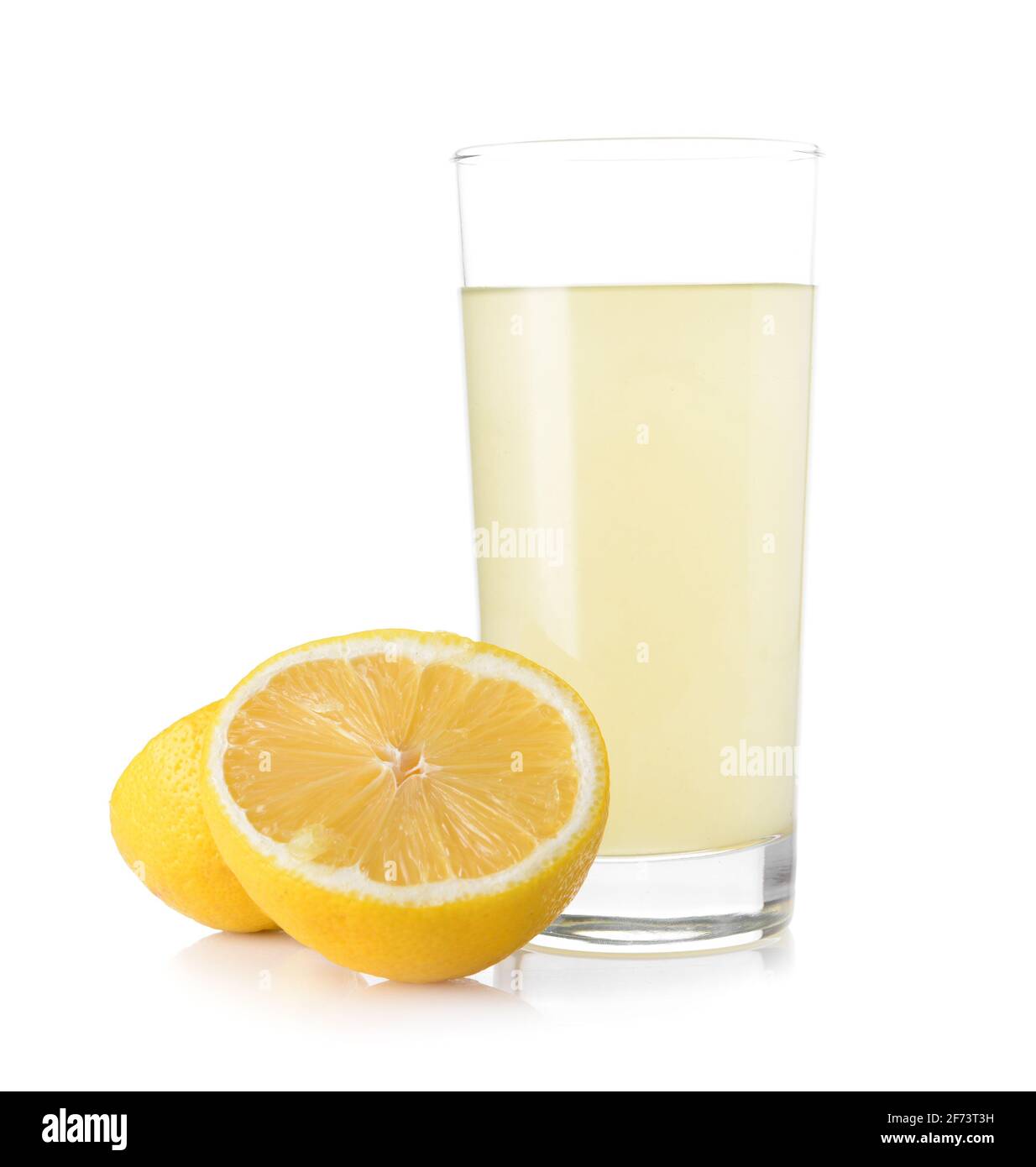 Glass of lemon juice on white background Stock Photo - Alamy