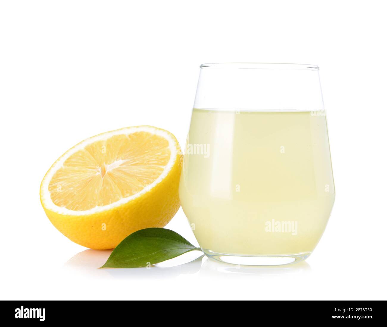 Glass of lemon juice on white background Stock Photo - Alamy