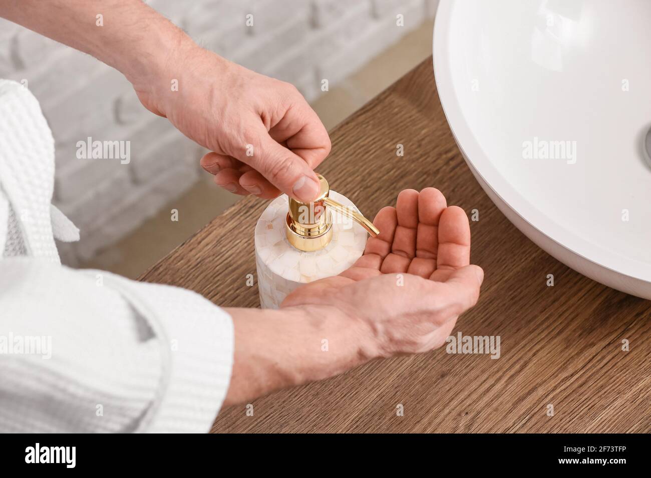 Man washing hands in bathroom Stock Photo - Alamy