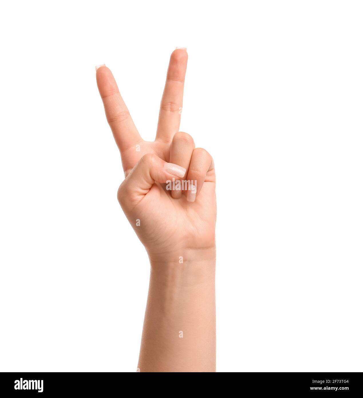 Female hand showing victory gesture on white background Stock Photo - Alamy