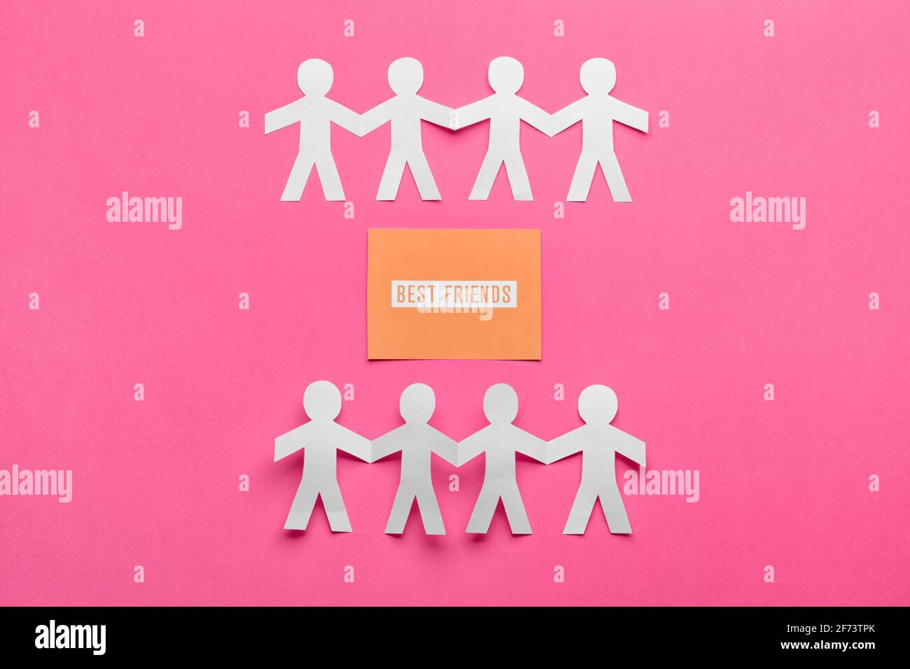 Paper human figures and greeting card for Friendship Day on color ...