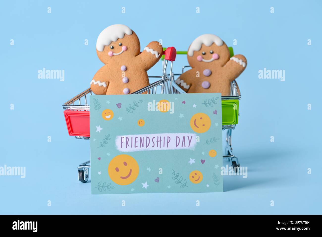 Shopping carts with cookies and greeting card for Friendship Day on ...