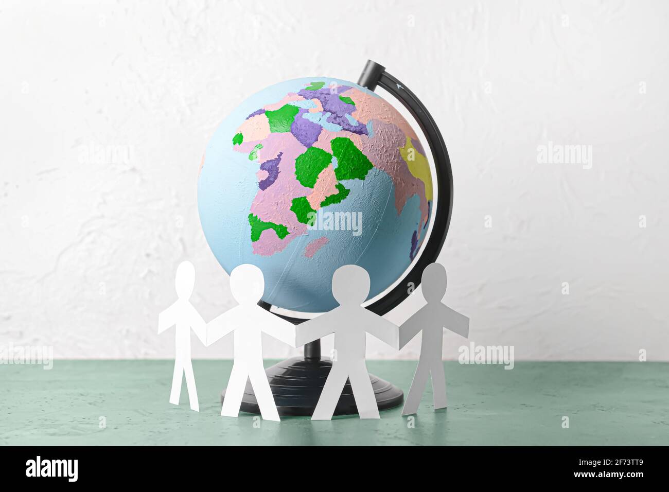 Human figures globe hi-res stock photography and images - Alamy