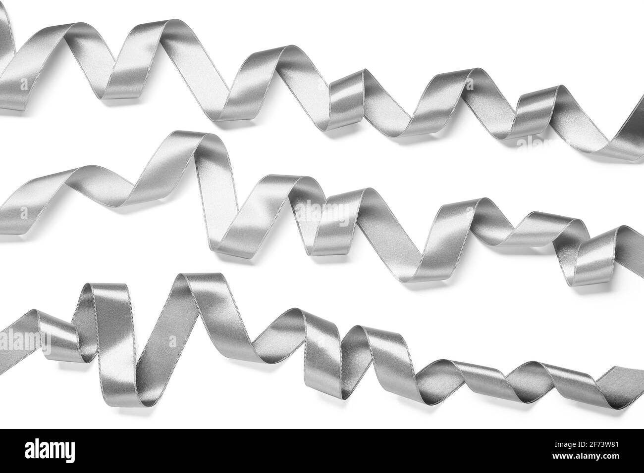 Silver ribbons on white background Stock Photo - Alamy