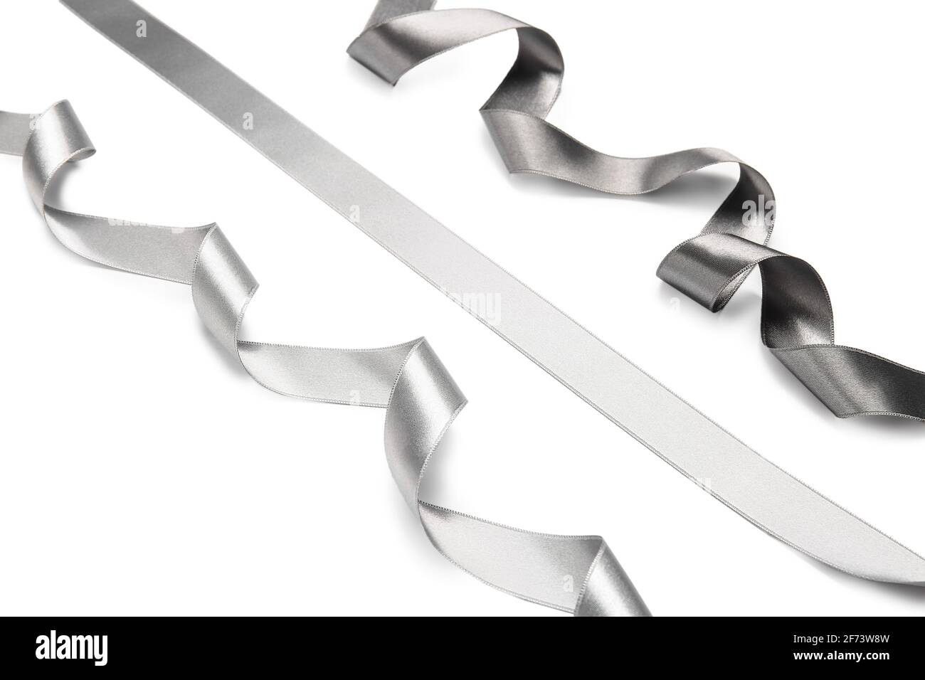 Silver ribbons on white background Stock Photo - Alamy