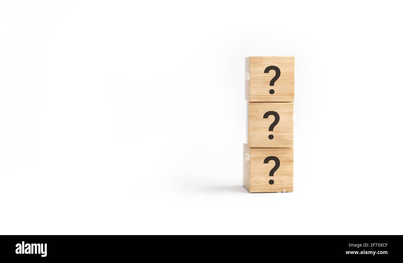 Wooden cube block shape with sign question mark symbol on white ...