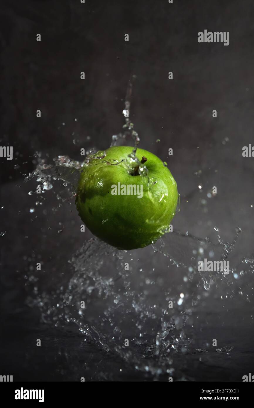 green apple in the spray Stock Photo - Alamy