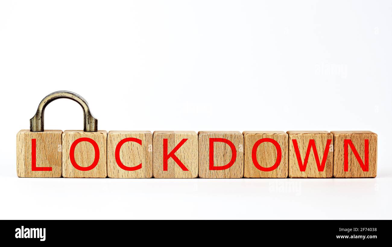 photo on lockdown theme. wooden cubes with the word "lockdown" and ...