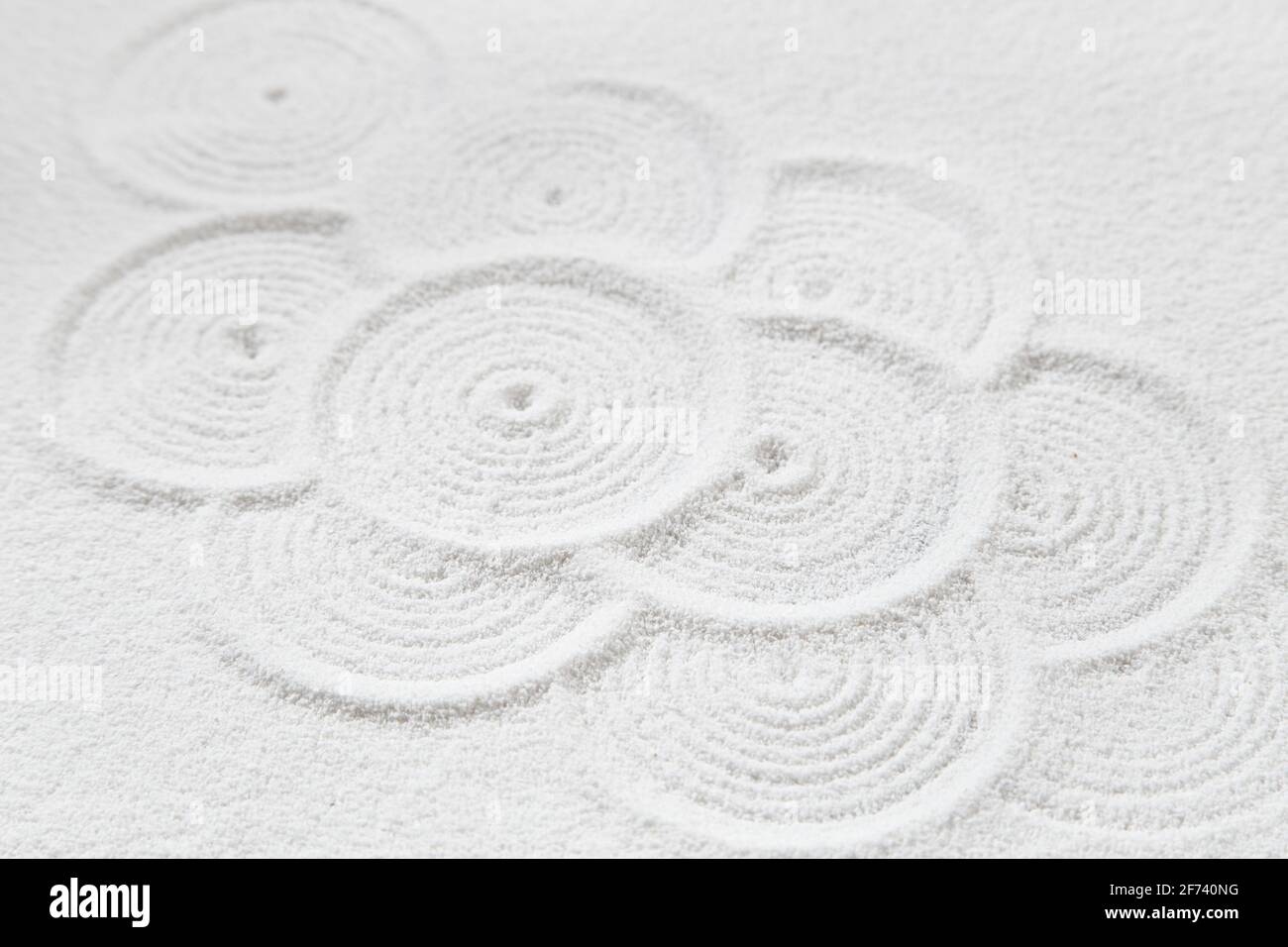 Zen pattern in white sand Stock Photo - Alamy