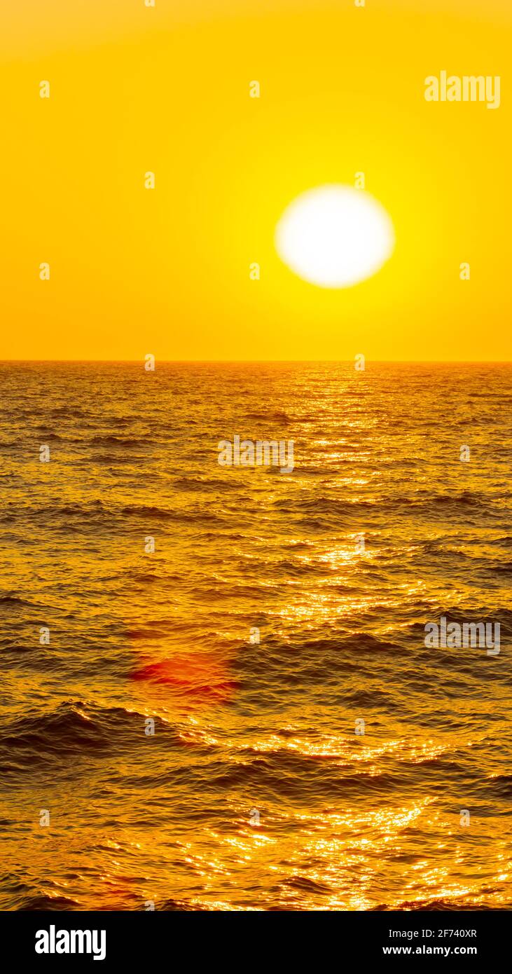 Orange sunset over sea. Bright sun over the sea horizon. Concept ...