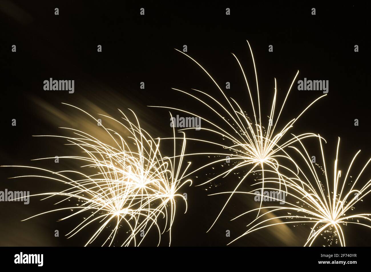 Luxury fireworks event sky show with beautiful fine yellow stars ...