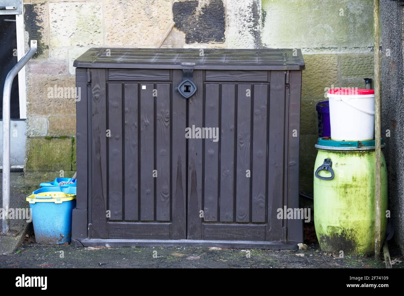 Brown storage secure bin box in disposal waste area Stock Photo - Alamy
