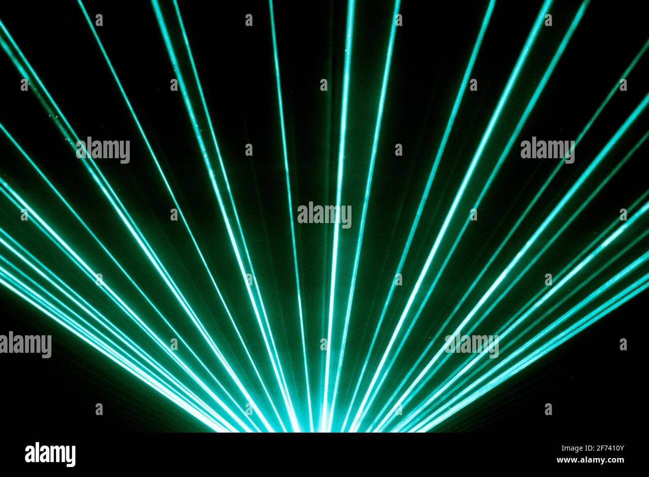 Turquoise laser show nightlife club stage shining sparkling rays ...