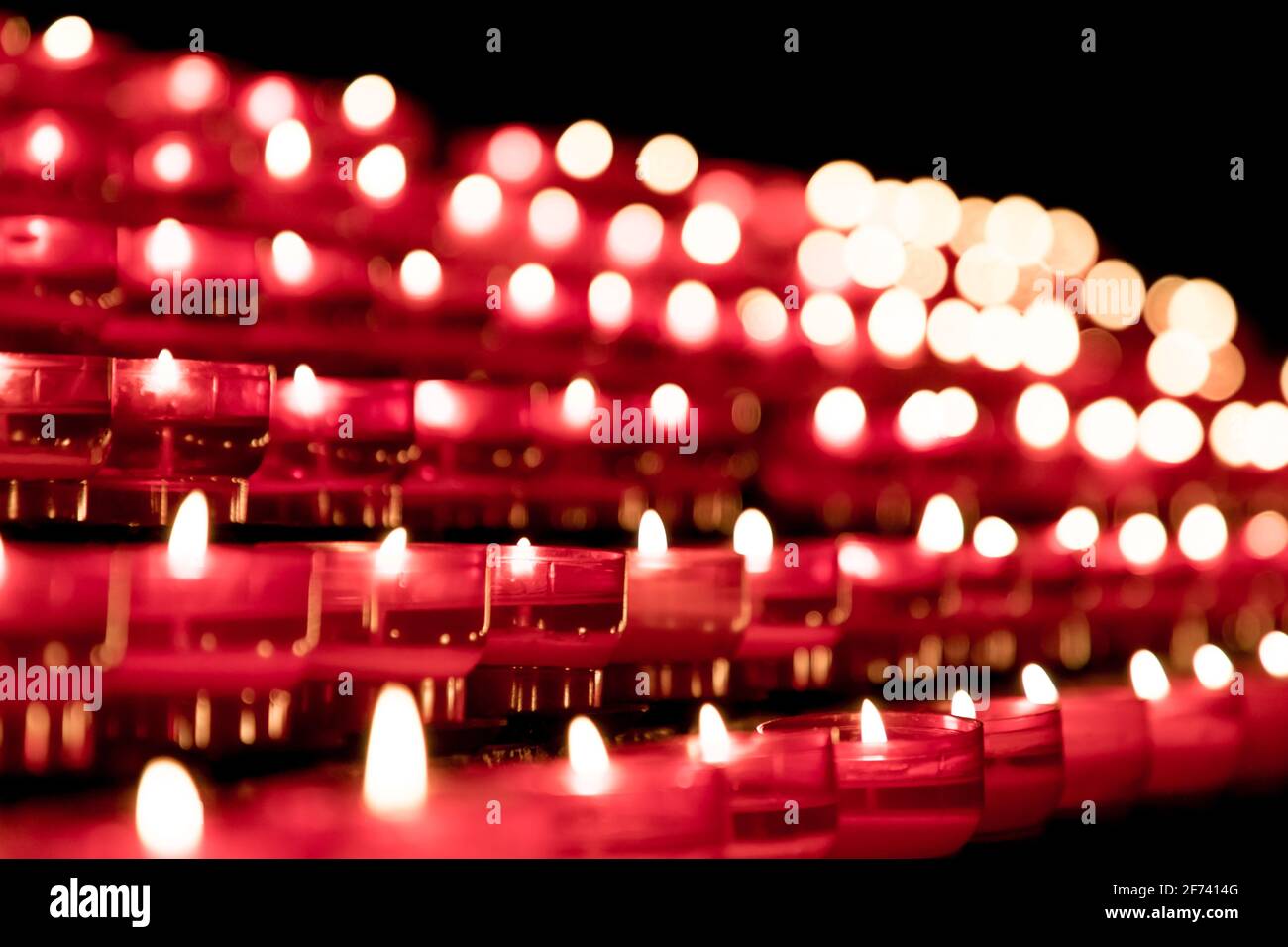 Group of red candles in church for faith resurrection prayer ...