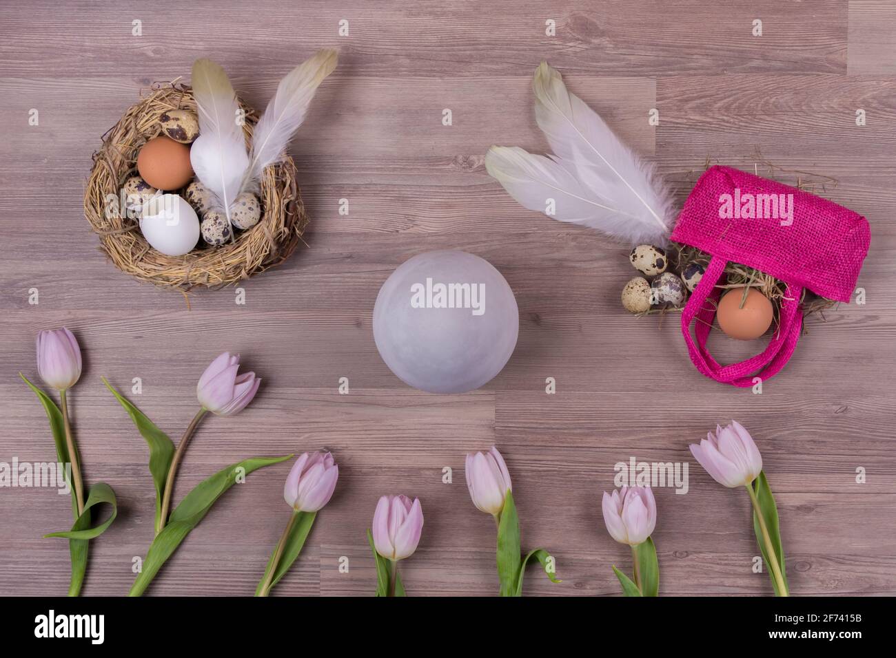 Easter holiday decoration design with eggs feathers bag tulips ...