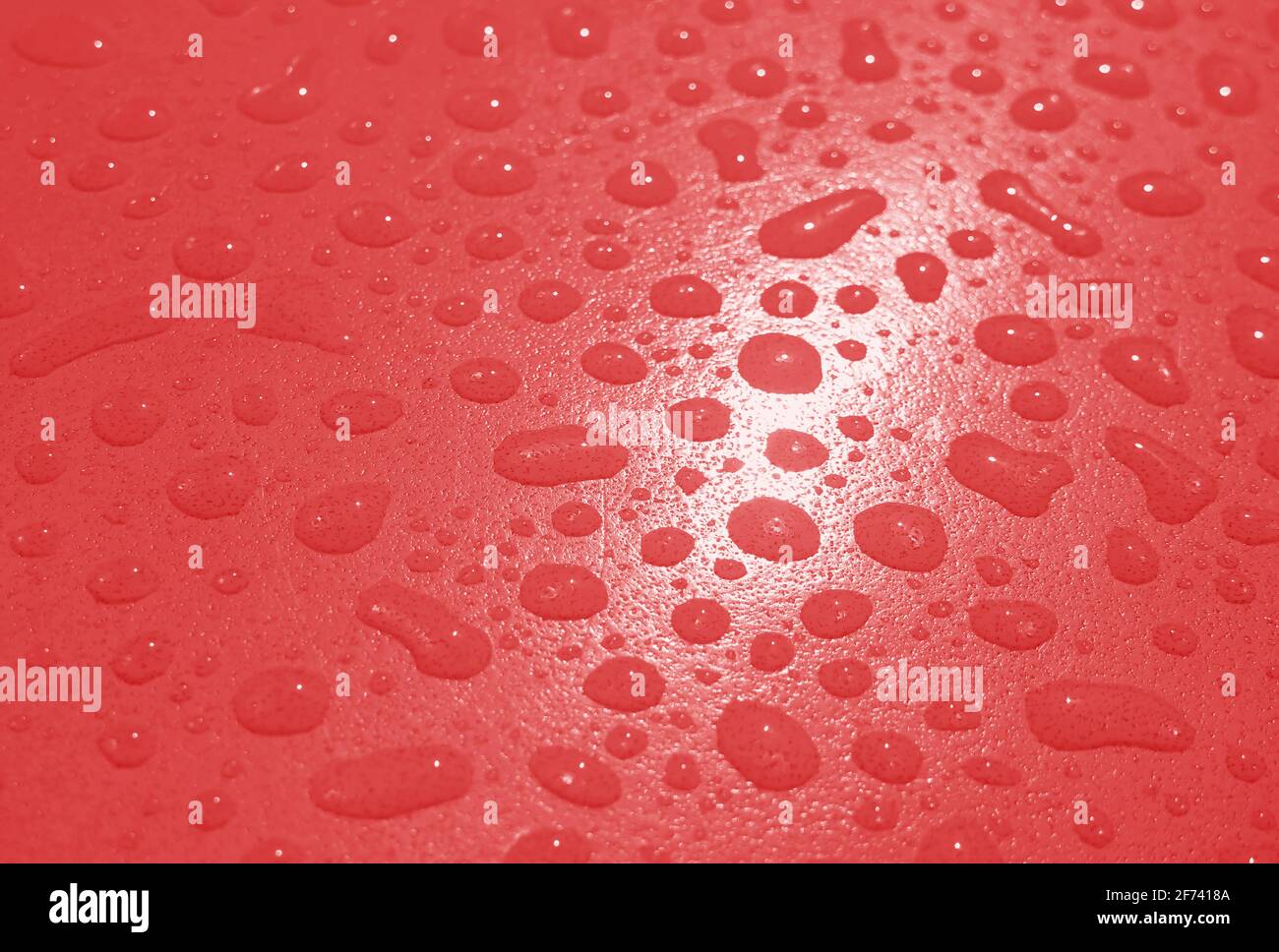 Pop art surreal style red colored water droplets on the tabletop after ...