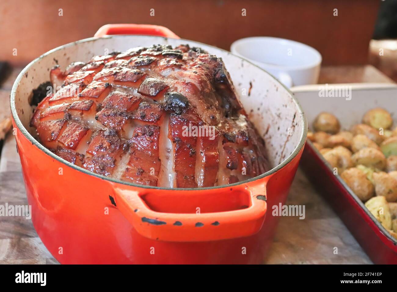 A leg of pork in a cooking pot Stock Photo - Alamy