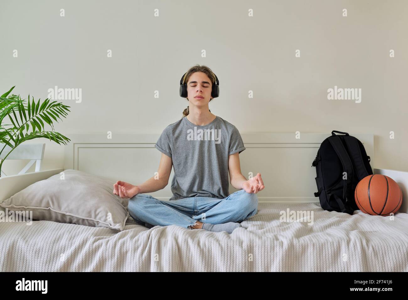 Portrait teenager meditating hi-res stock photography and images - Alamy