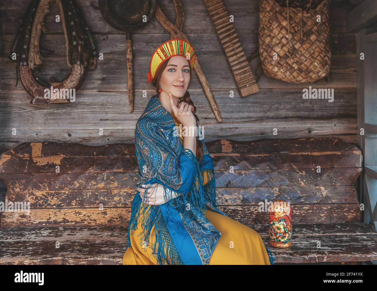 Russian beauty closeup on the traditional background with different ...