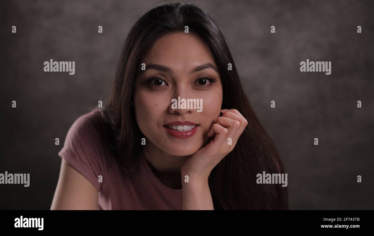 Close-up of a young woman with a satisfied facial expression Stock ...