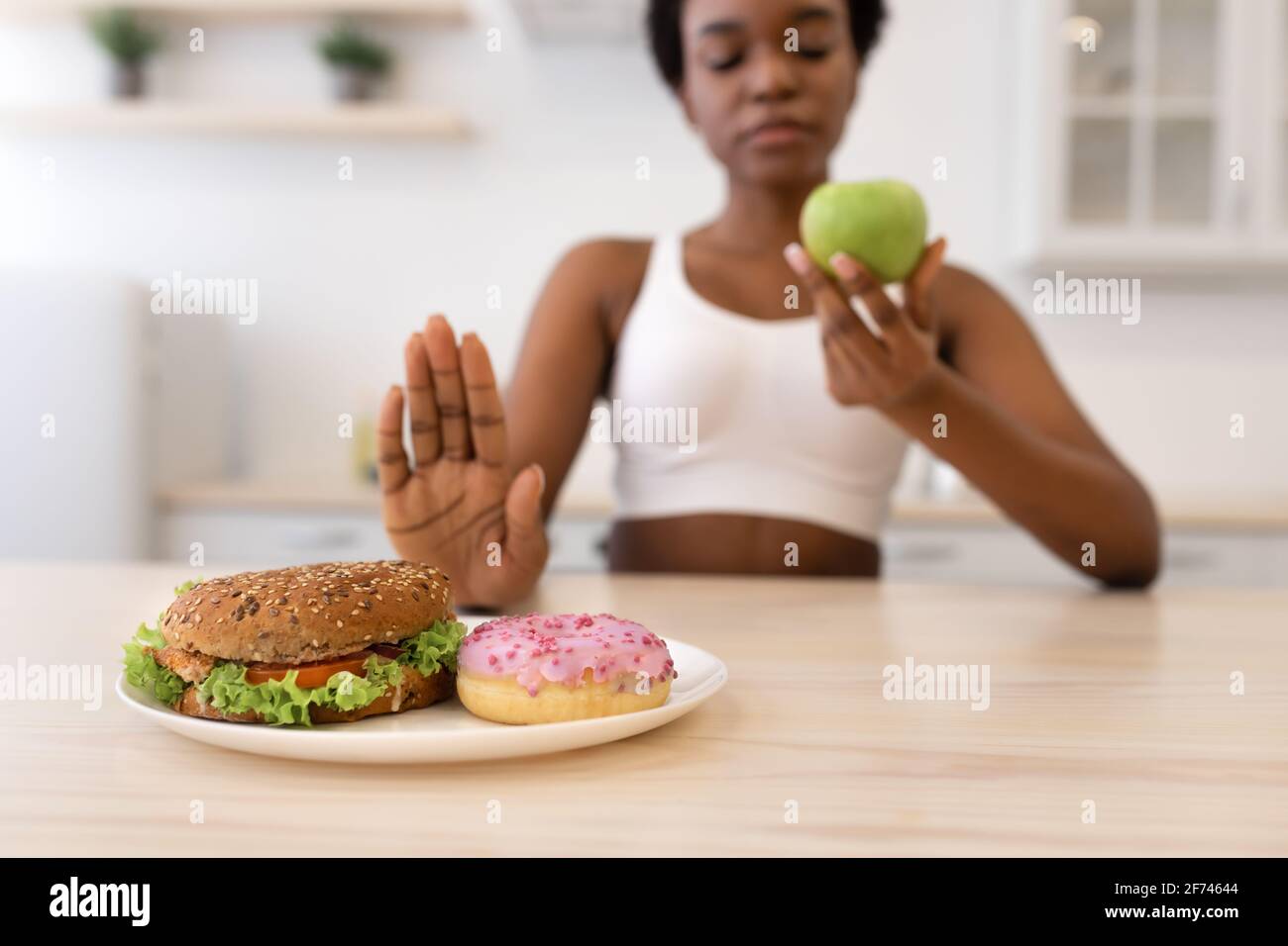 Woman refusing eat unhealthy burger hi-res stock photography and images ...