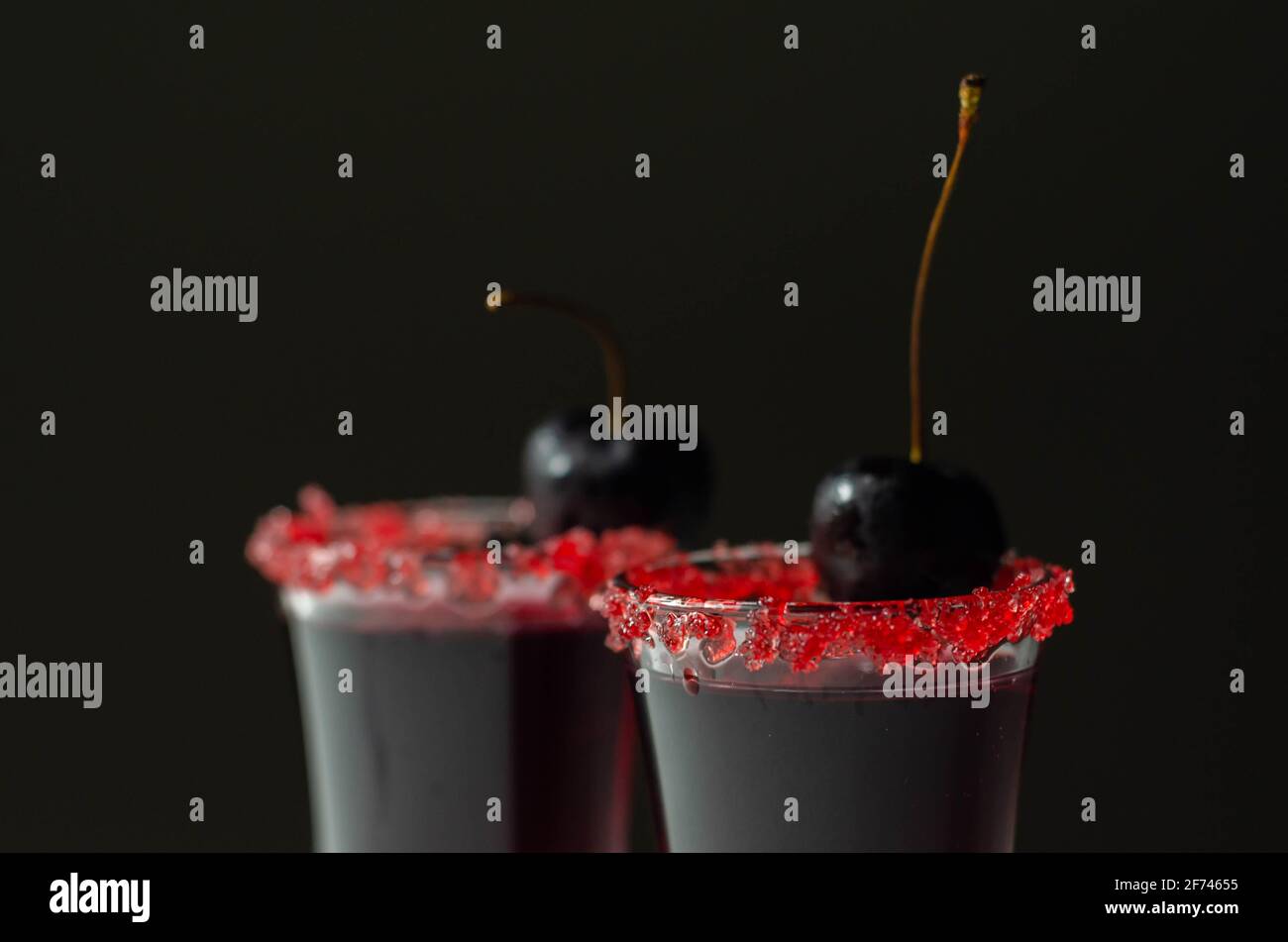 Ruby red cocktail based on vodka, cherry liqueur and syrup in drink ...