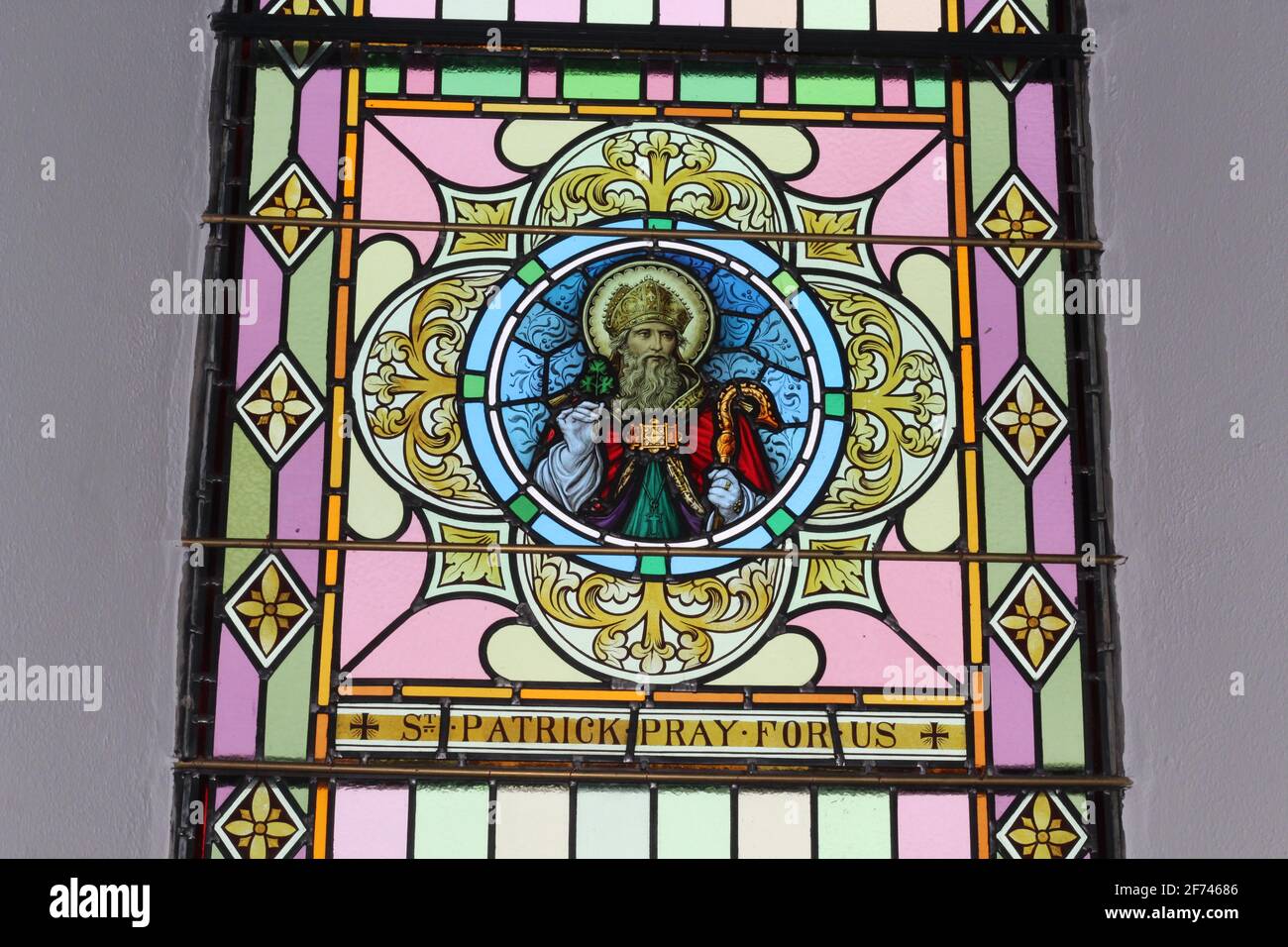 A stained glass window of Saint Patrick, the patron saint of Ireland ...