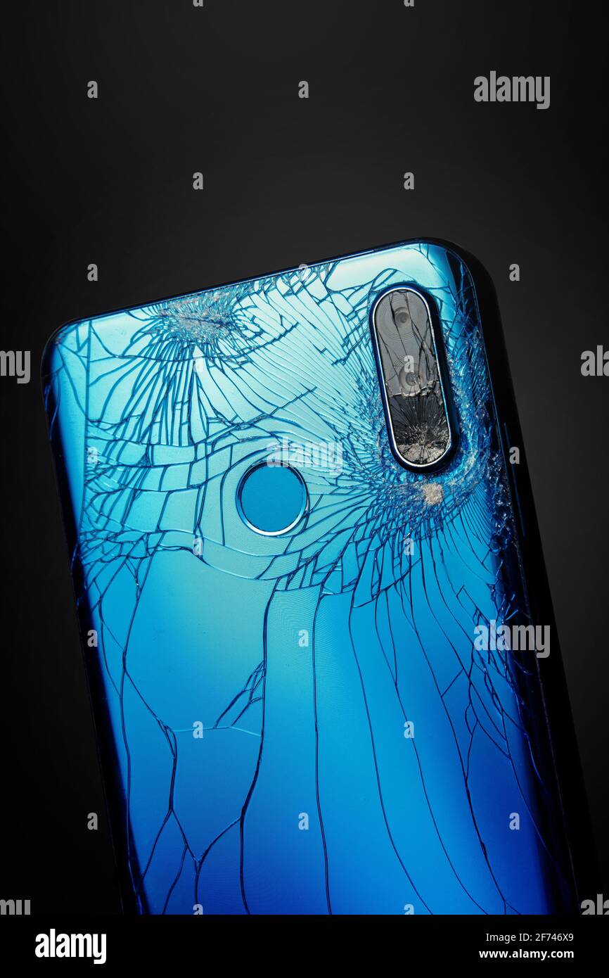 Broken smartphone. Mobile phone with a broken camera Stock Photo - Alamy