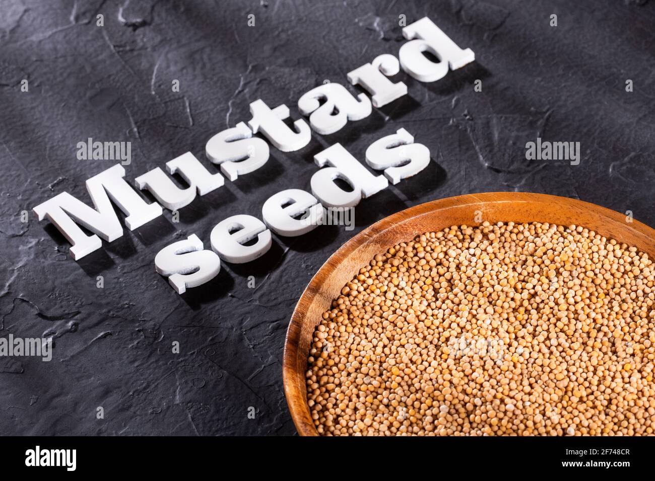 Sinapis alba - Yellow mustard seeds Stock Photo - Alamy