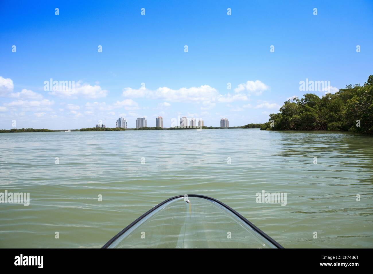 Clear kayak forges through the waterway of Lovers Key in Bonita Springs ...